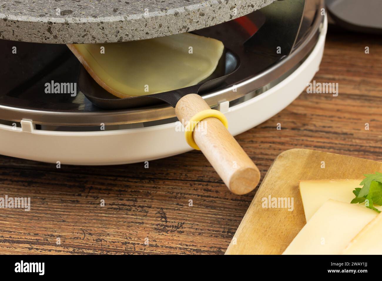 raclette cheese and plate of charcuterie on a table Stock Photo - Alamy