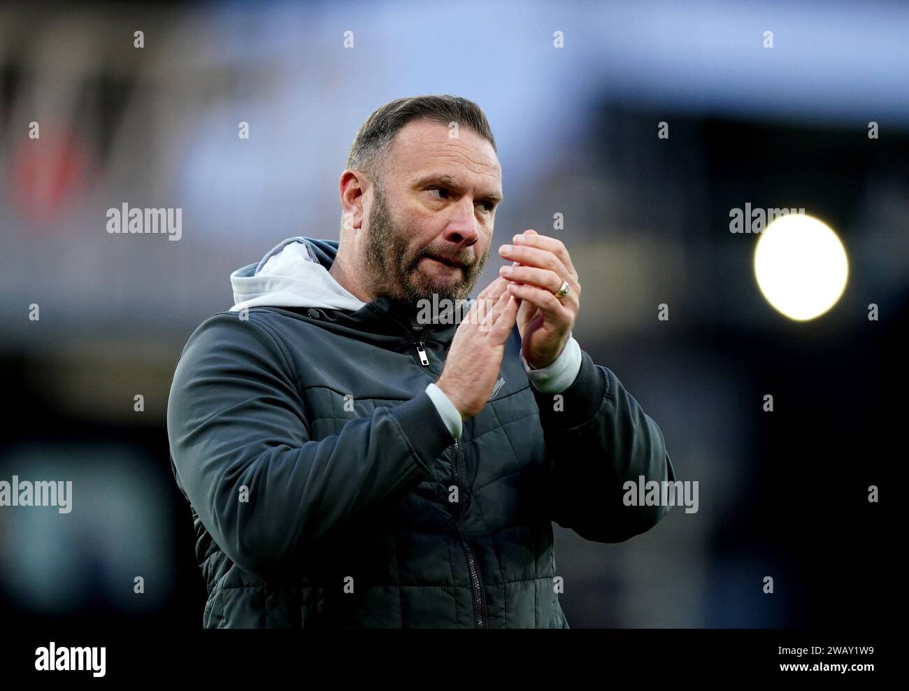 Bolton Wanderers' Ian Evatt applauds the fans at the end of the ...