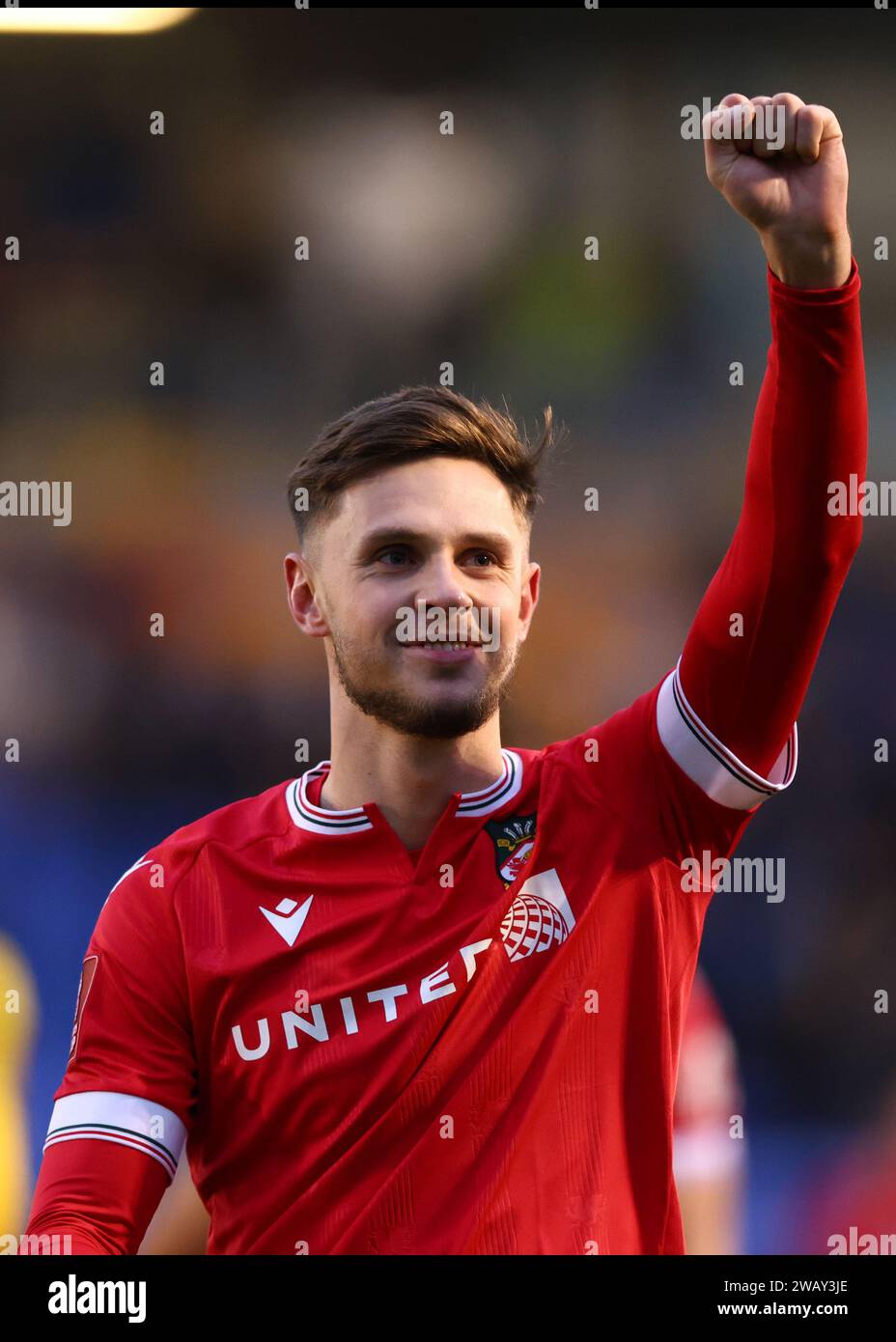 Shrewsbury, UK. 7th Jan, 2024. Ryan Barnett of Wrexham celebrates the ...