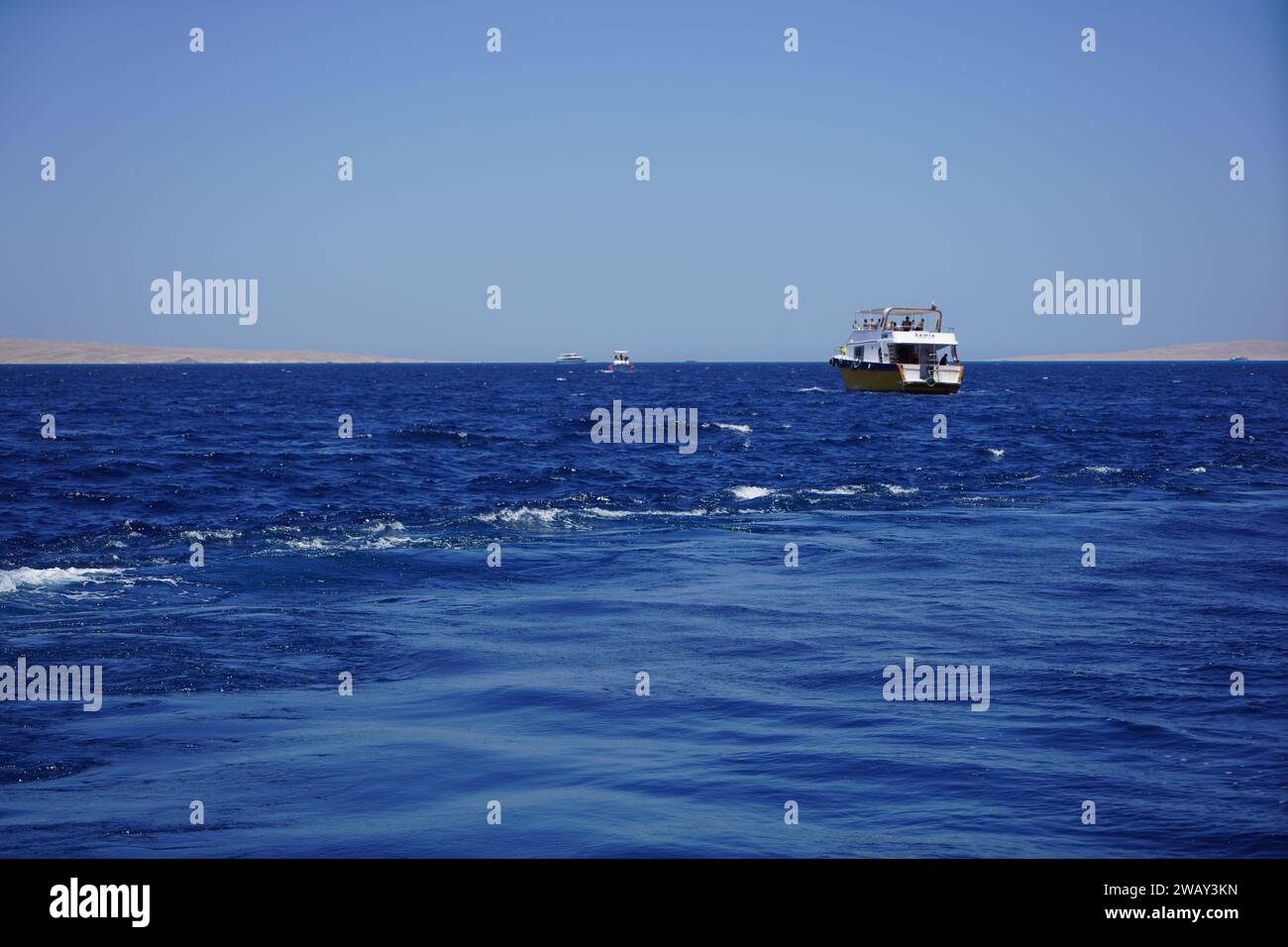 showcases a luxurious yacht sailing in the Red Sea, symbolizing leisure ...