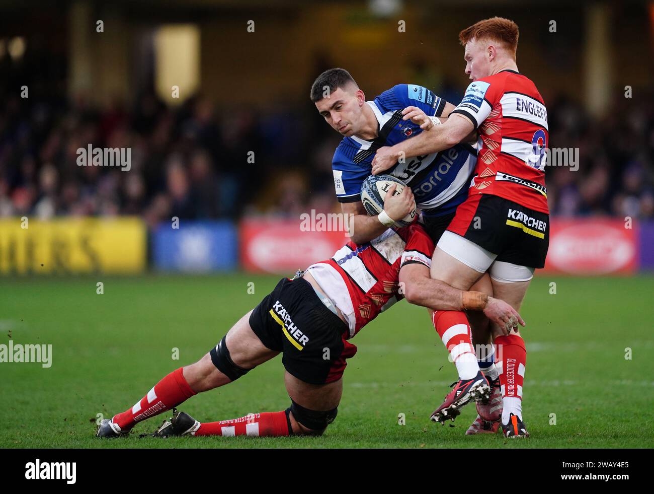 Bath's Cameron Redpath is tackled by Gloucester's Caolan Englefield ...