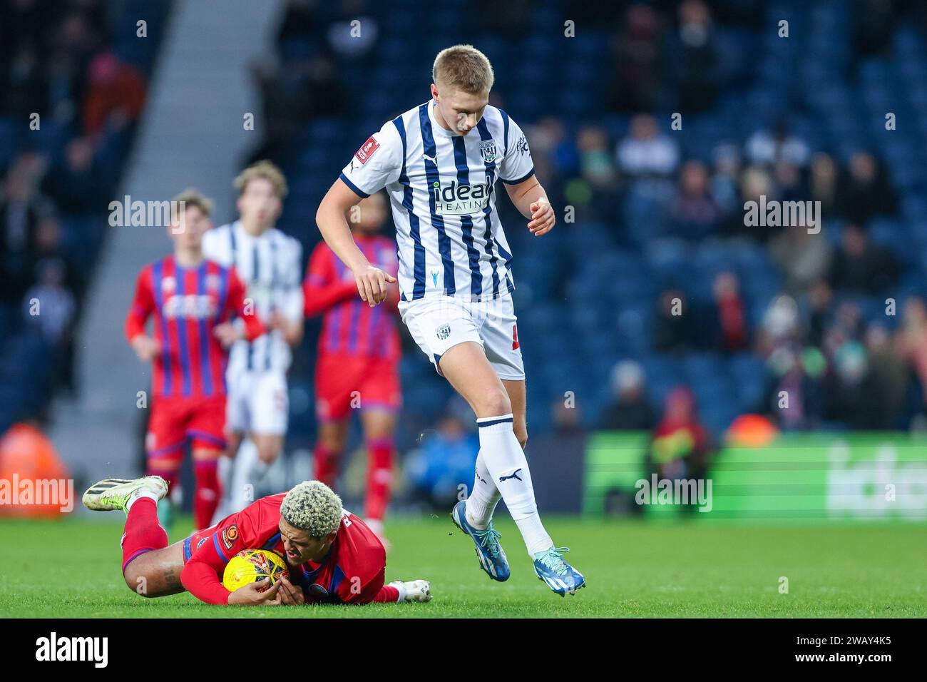 West Bromwich, UK. 07th Jan, 2024. Aldershot's Coby Rowe is forced down ...