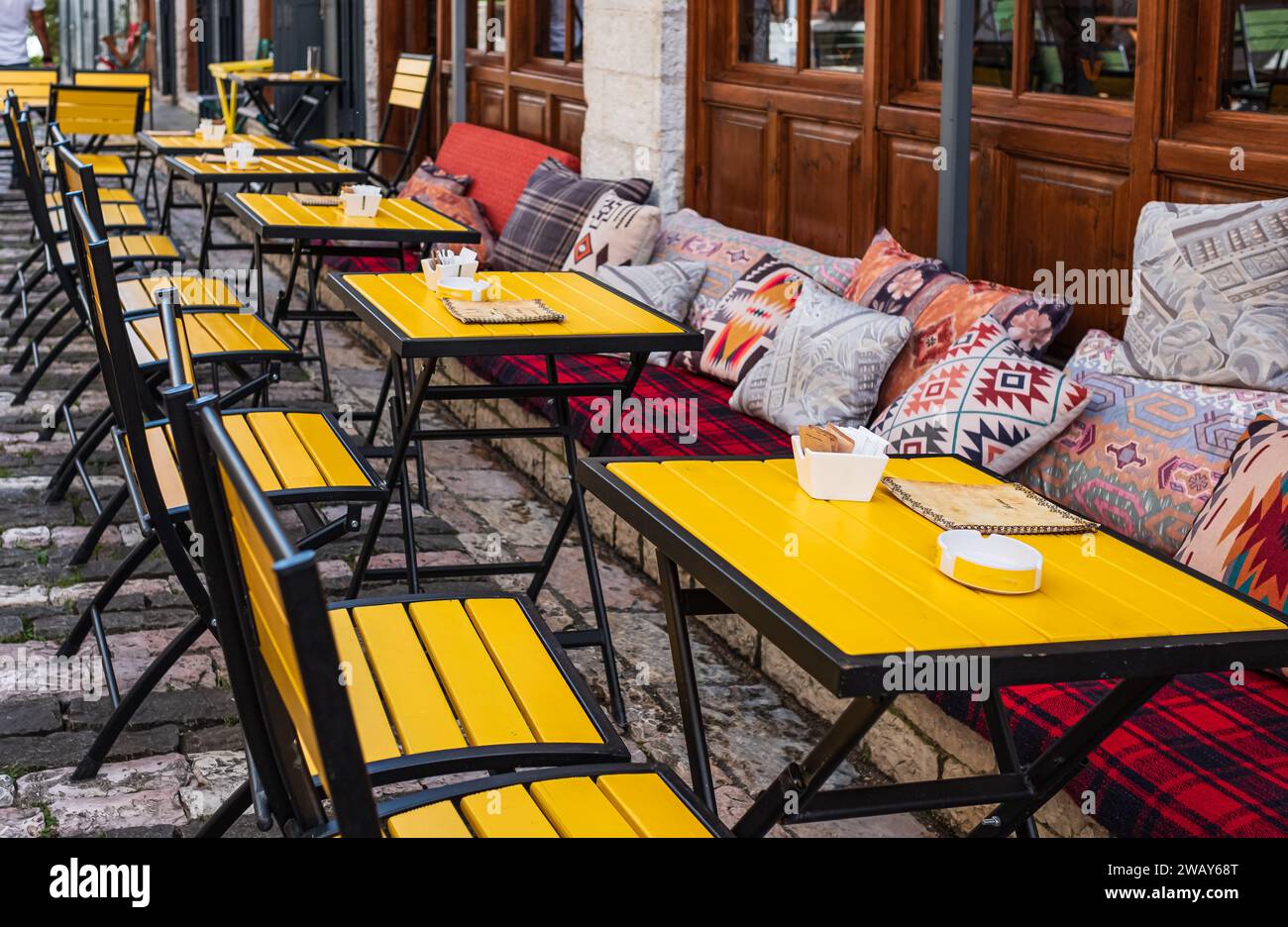 Street view of a coffee terrace with tables and chairs. Free cafe table ...