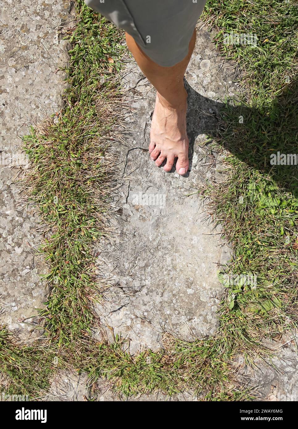 barefoot man walking on the stones of the very ancient Roman road Stock ...