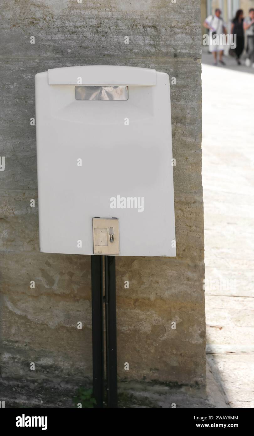 white post box for posting letters and documents to be sent around the ...