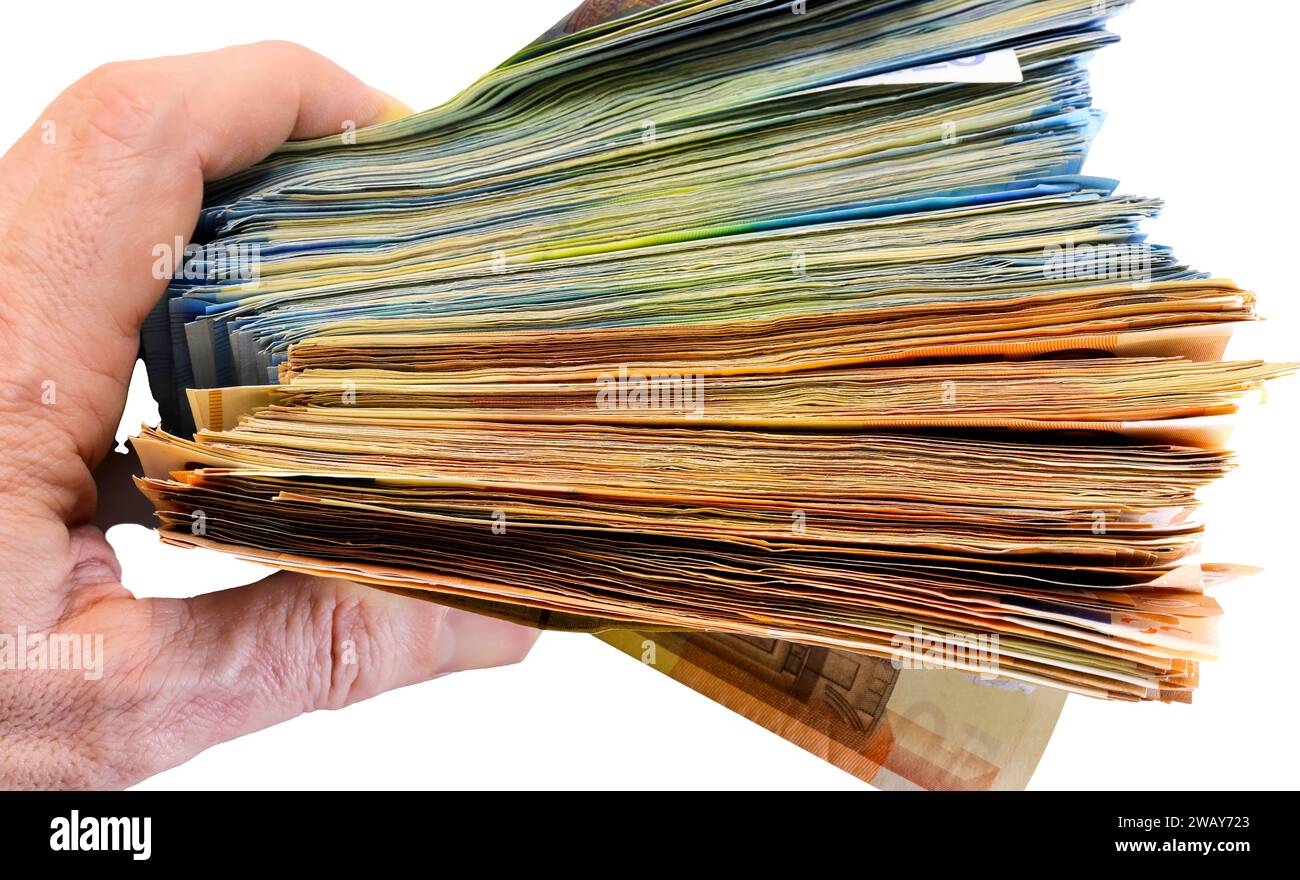 hand of man while grabbing a lot of money in paper banknotes on white ...