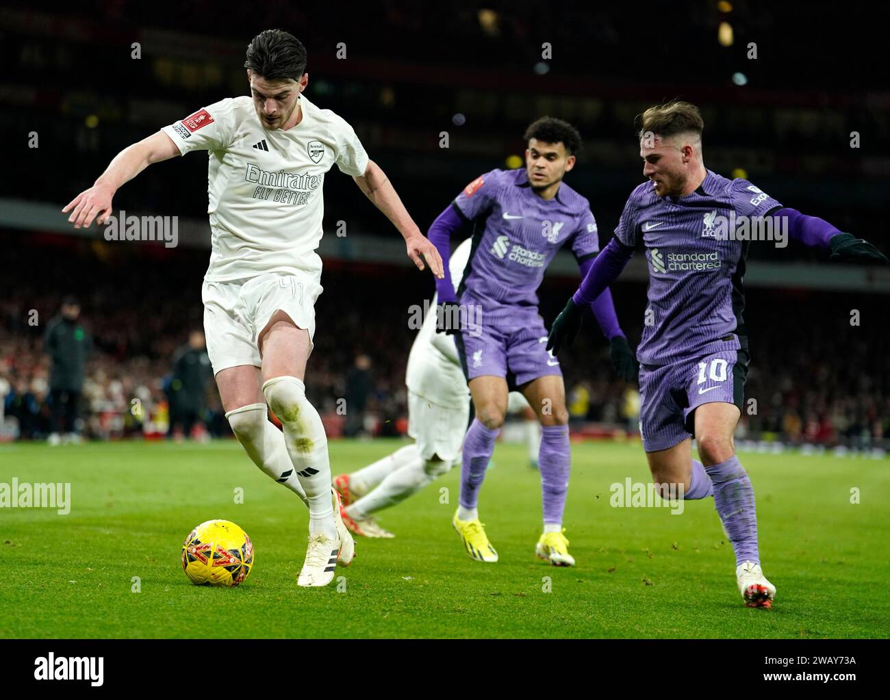 Arsenal's Declan Rice (left) and Liverpool's Alexis Mac Allister battle ...