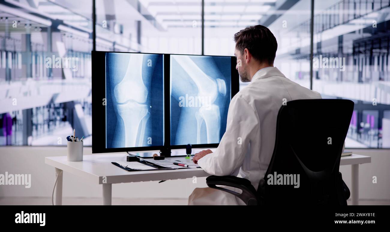 Male doctor using computer side hi-res stock photography and images - Alamy