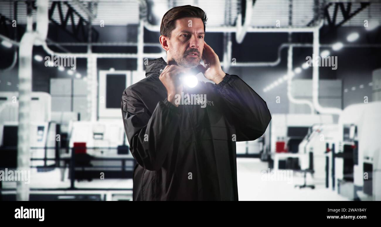 Security Guard At Night With Flashlight At Chip Factory Stock Photo - Alamy