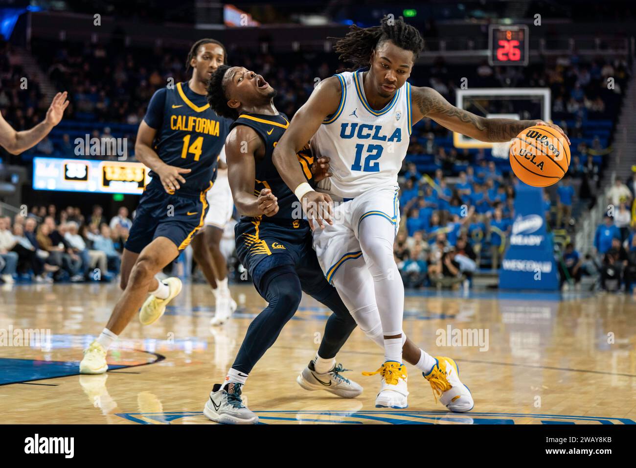 UCLA Bruins guard Sebastian Mack (12) is defended by California Golden ...