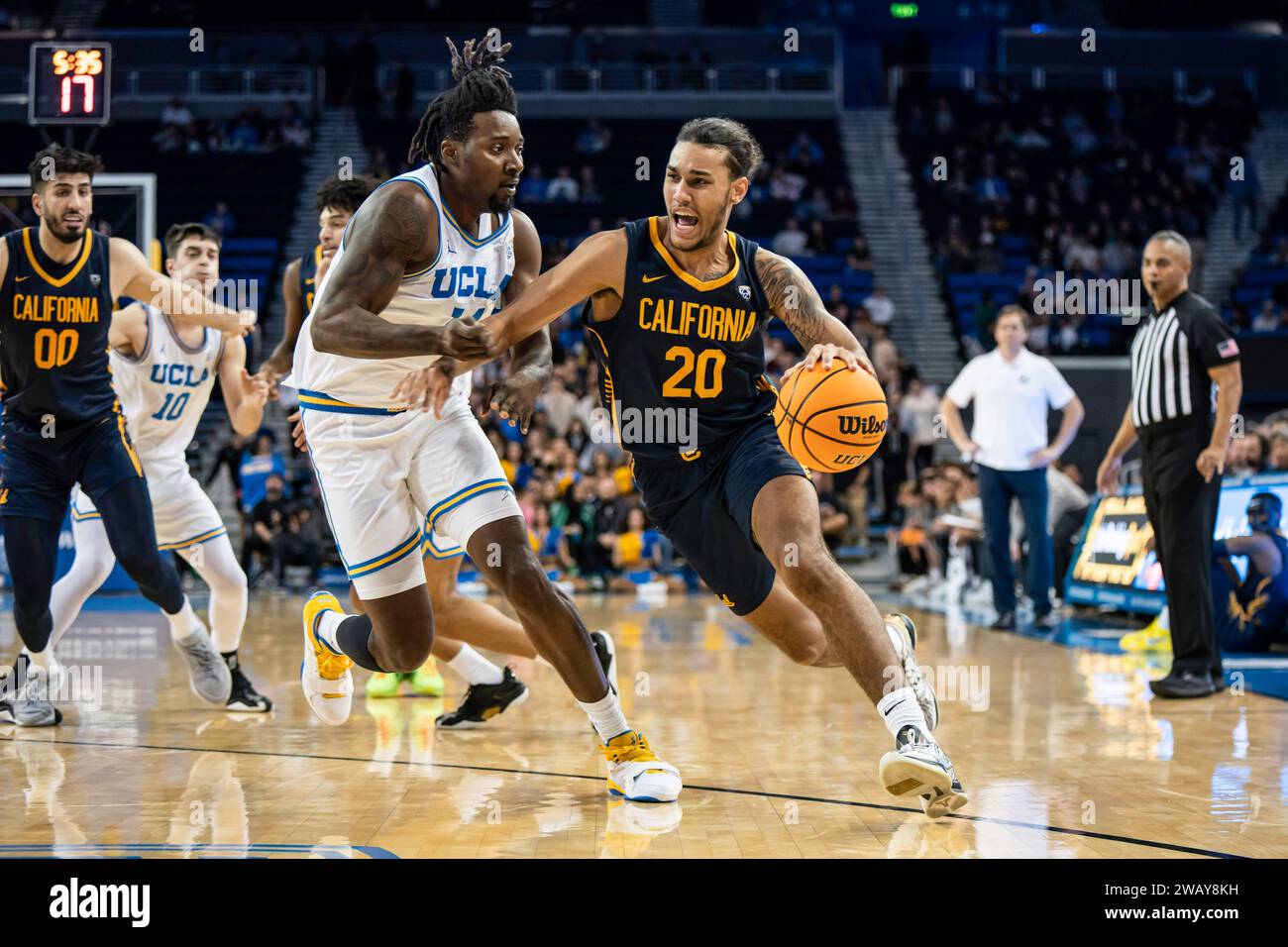 California Golden Bears guard Jaylon Tyson (20) is defended by UCLA ...