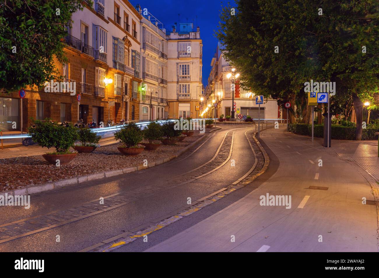 Scenic view of the facades of old houses in night lighting. Cadiz ...