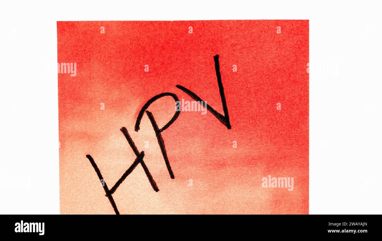 HPV handwriting text close up isolated on orange paper with copy space ...