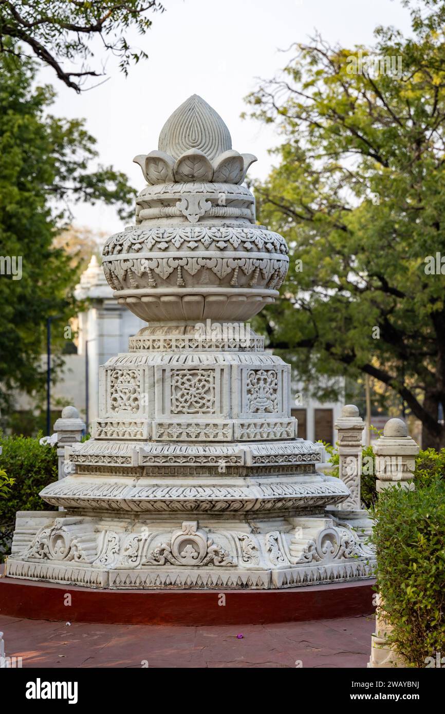 isolated jain holy marble pillars with unique art at day from flat ...