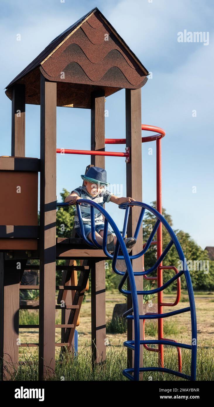 Cute caucasian little kid boy having fun while playing on the ...