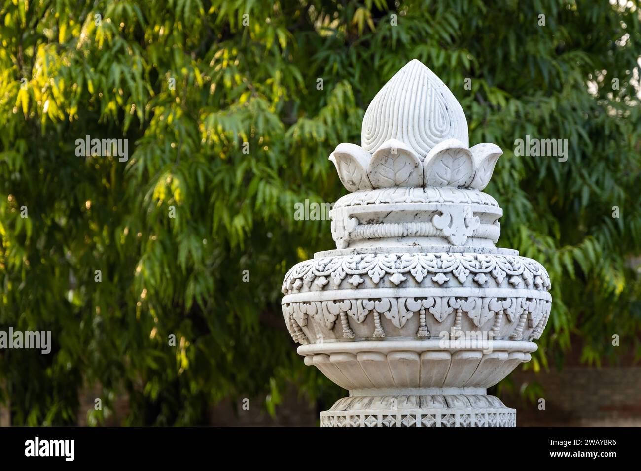 isolated jain holy marble pillars with unique art at day from flat ...