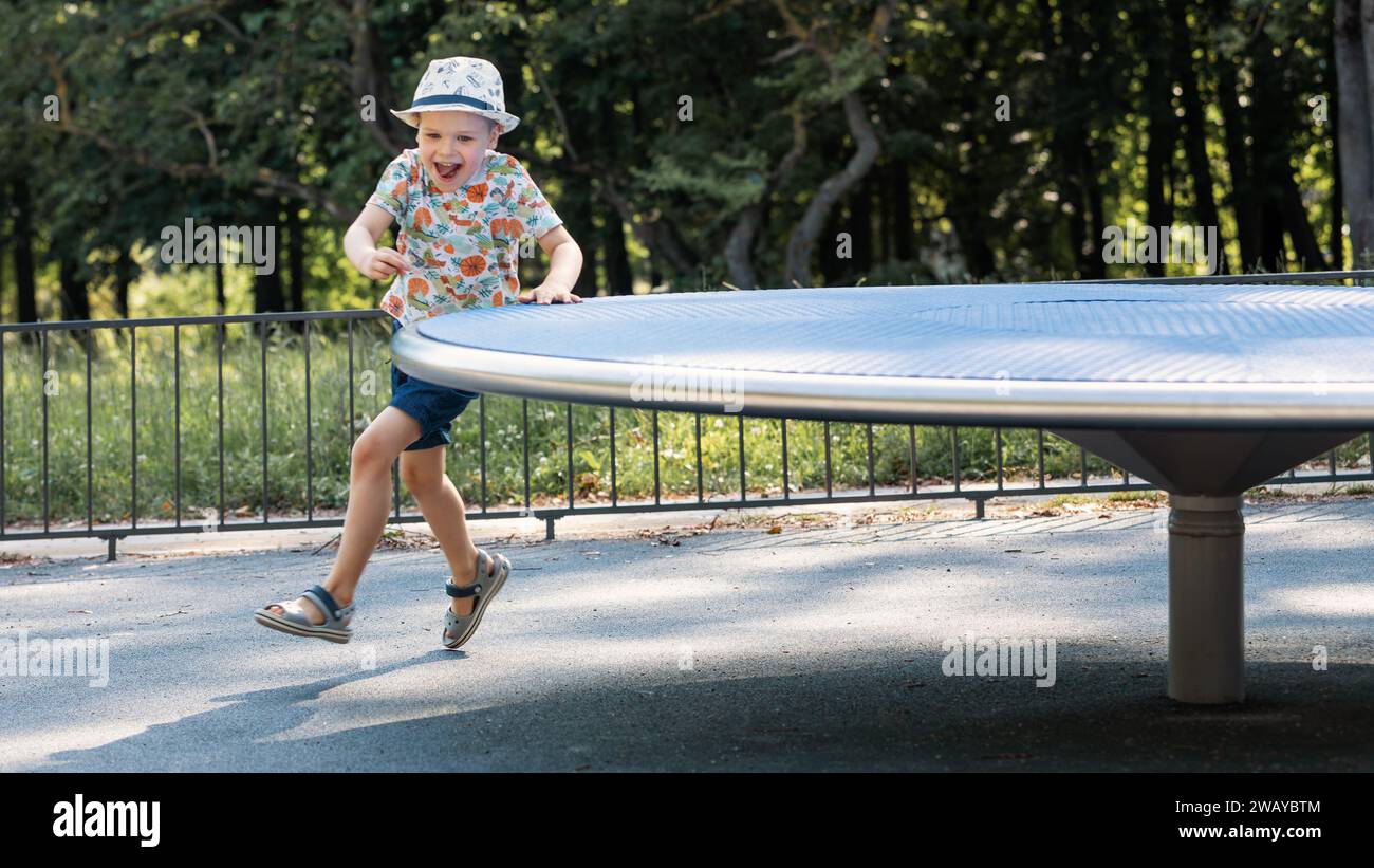 Little boy playing on playground hi-res stock photography and images ...