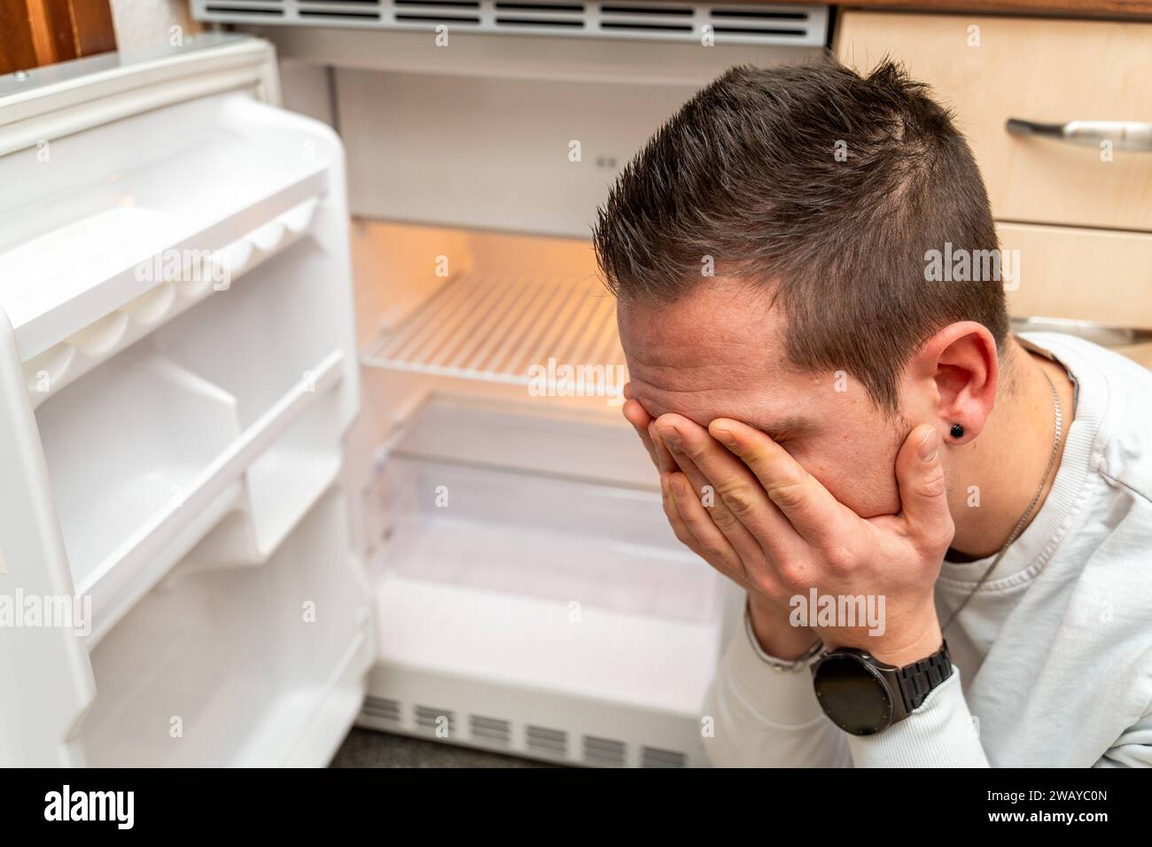 Bavaria, Germany - January 6, 2024: A sad man in front of an empty ...