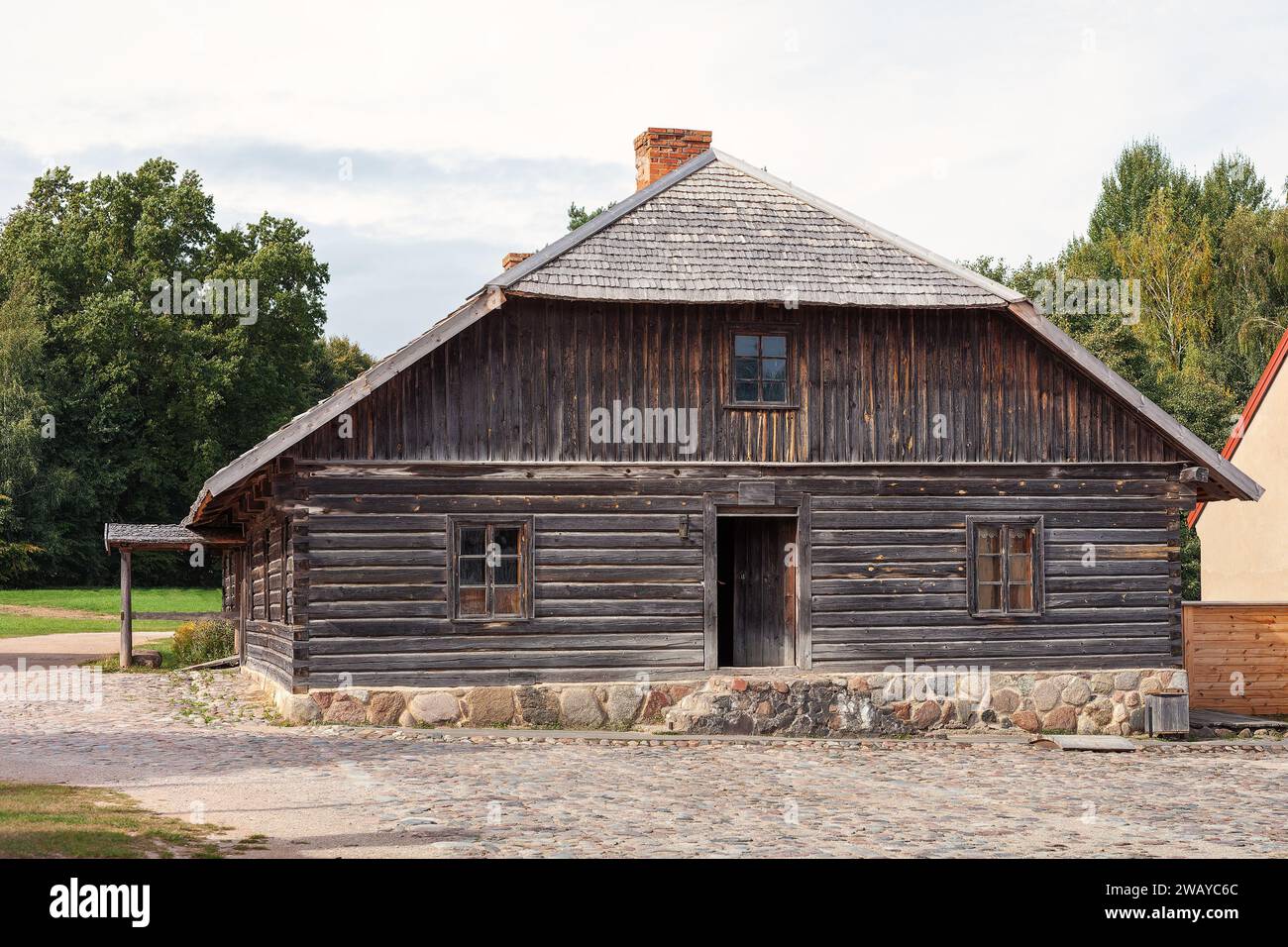 Ancient large residential wooden country house with stone foundations ...
