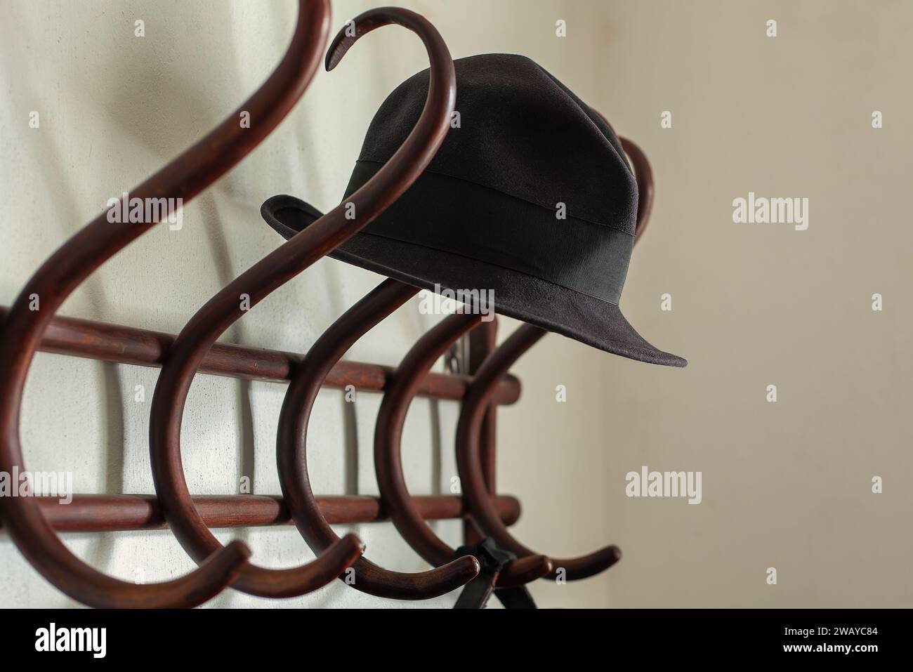 Vintage wooden homemade hat rack and vintage black hat Stock Photo - Alamy