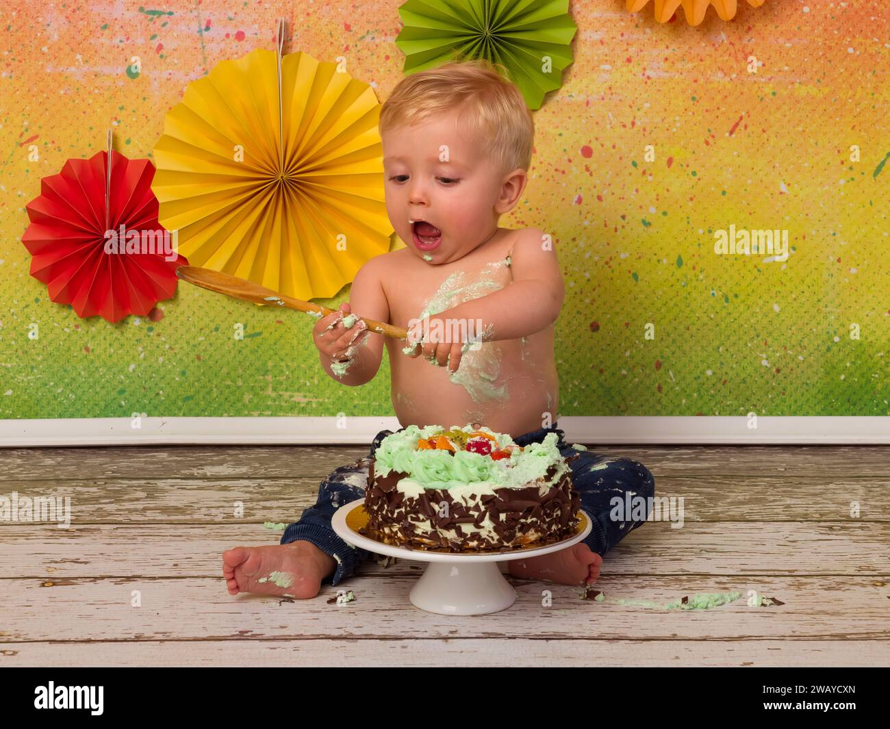 Colorful images shot during the first birthday party of a little blonde ...