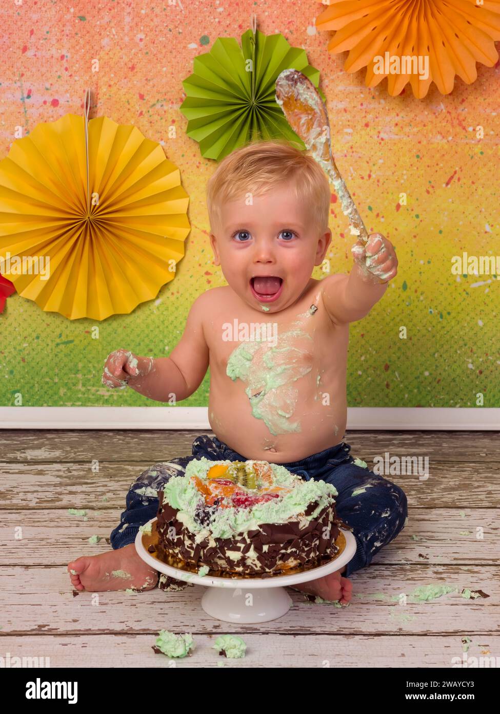 Colorful images shot during the first birthday party of a little blonde ...