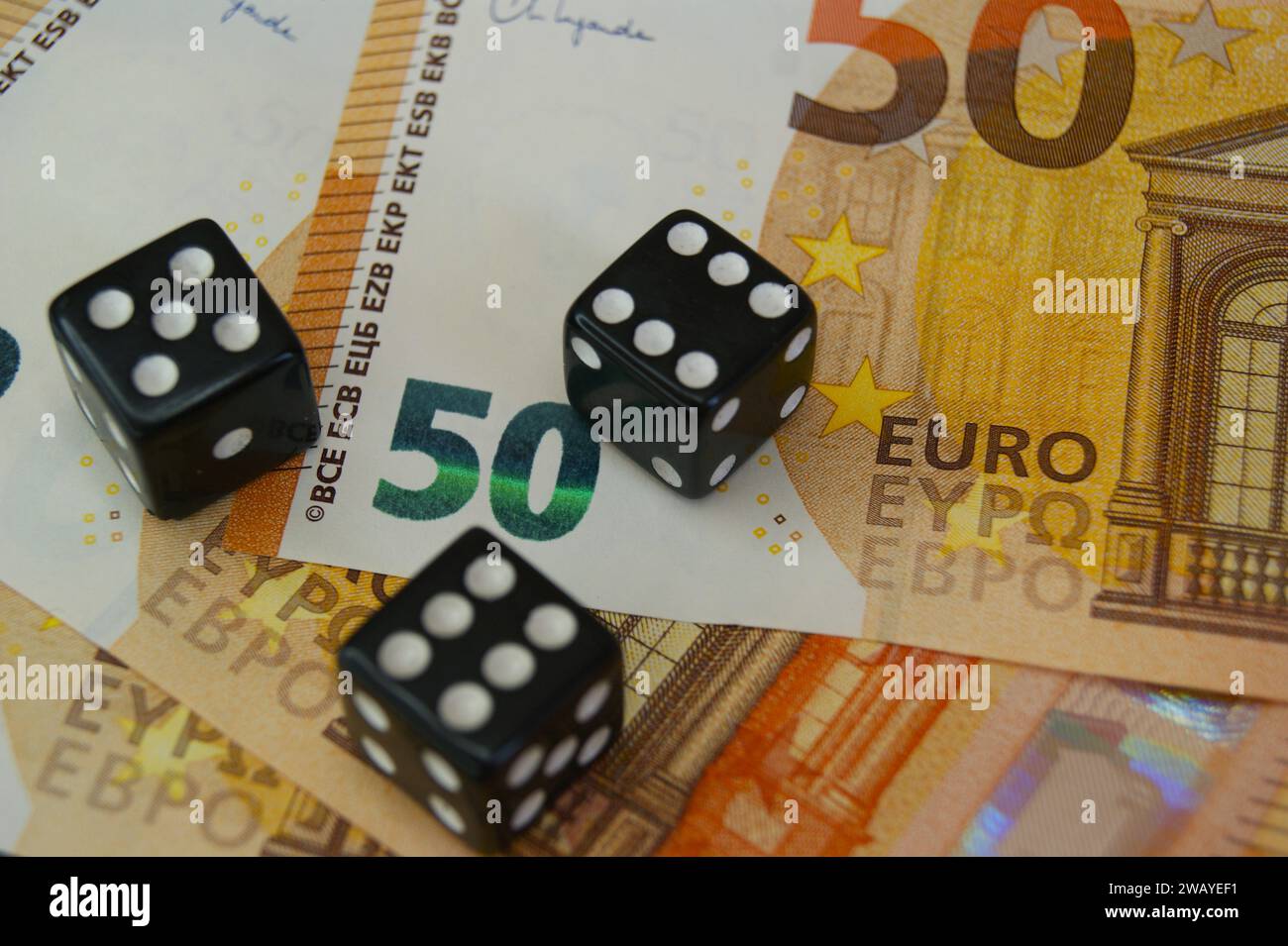 Unpredictable economic situation,concept. Three dice on new 50 euro ...