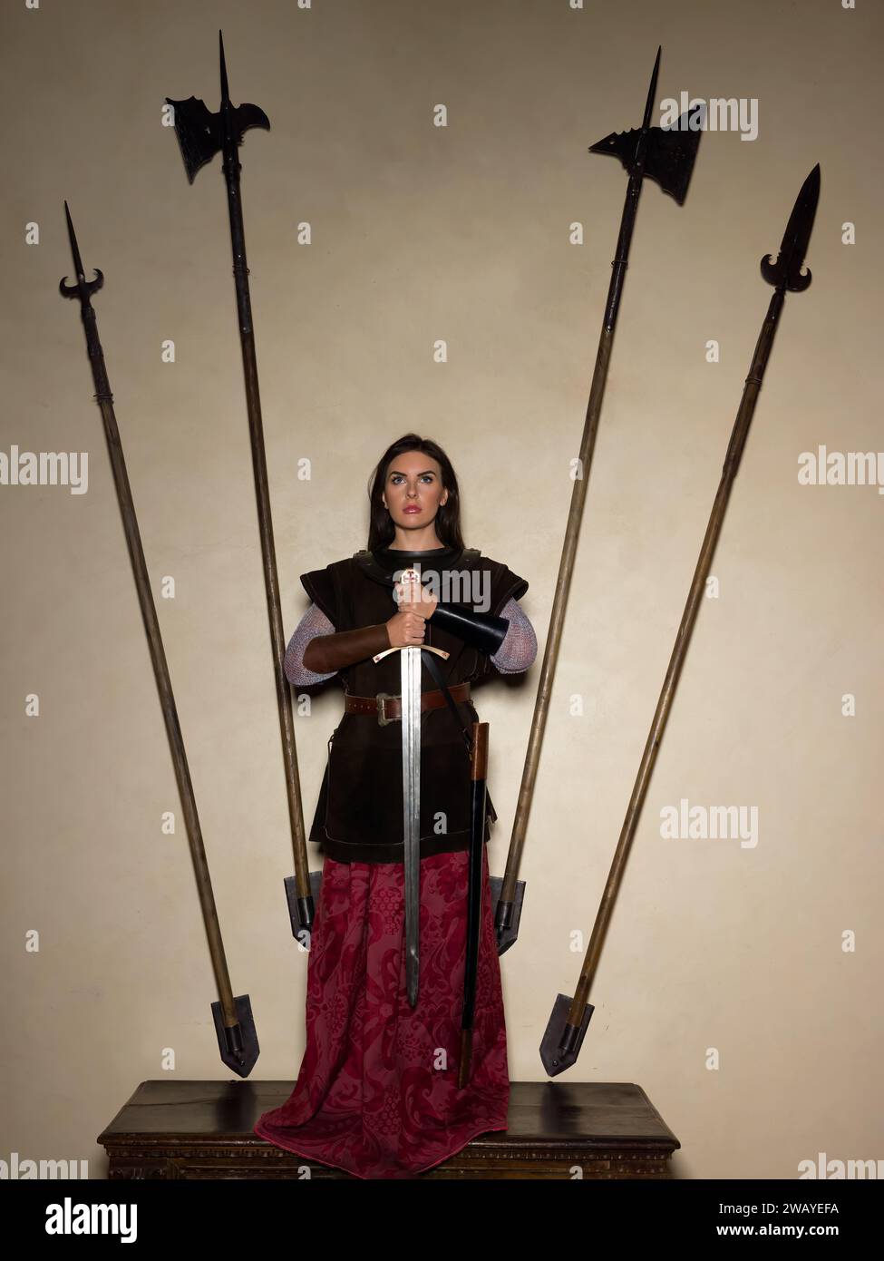 Reenactment scene of a female medieval knight in armor depicting the ...