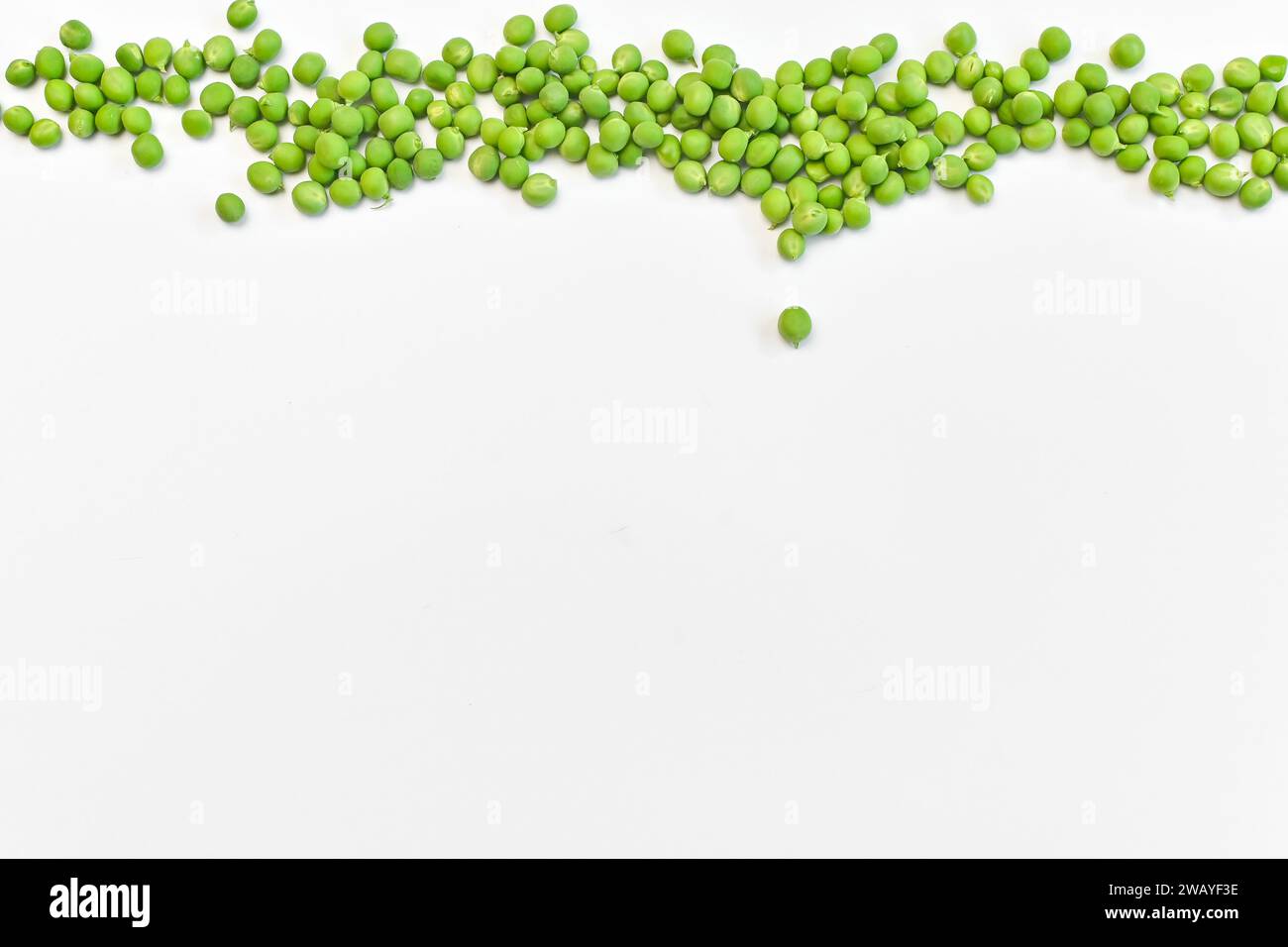 Green peas border on white background. copy space Stock Photo - Alamy