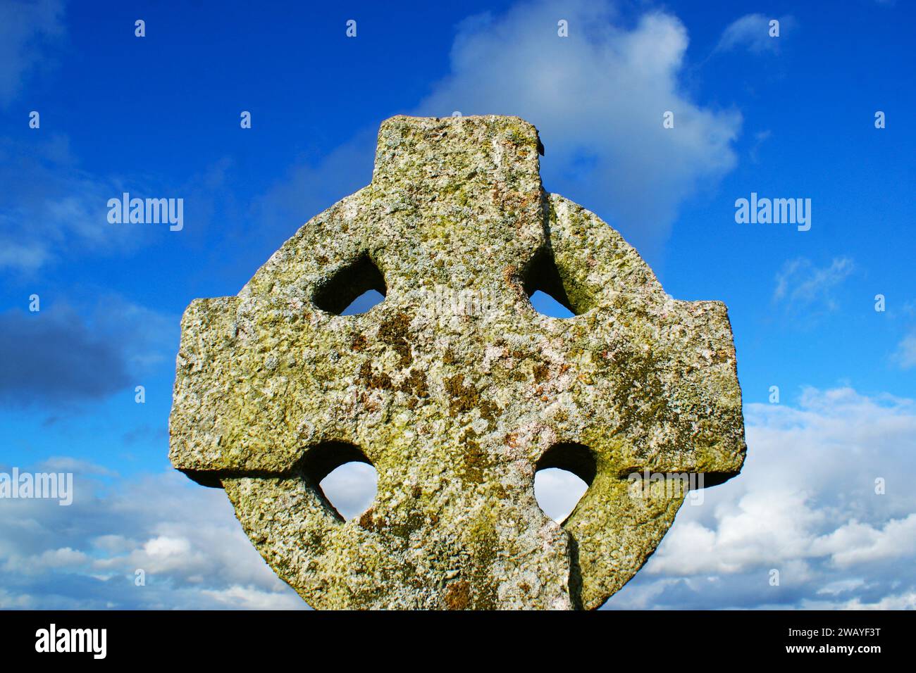 Old Celtic cross on sky background. Stone cross Stock Photo - Alamy