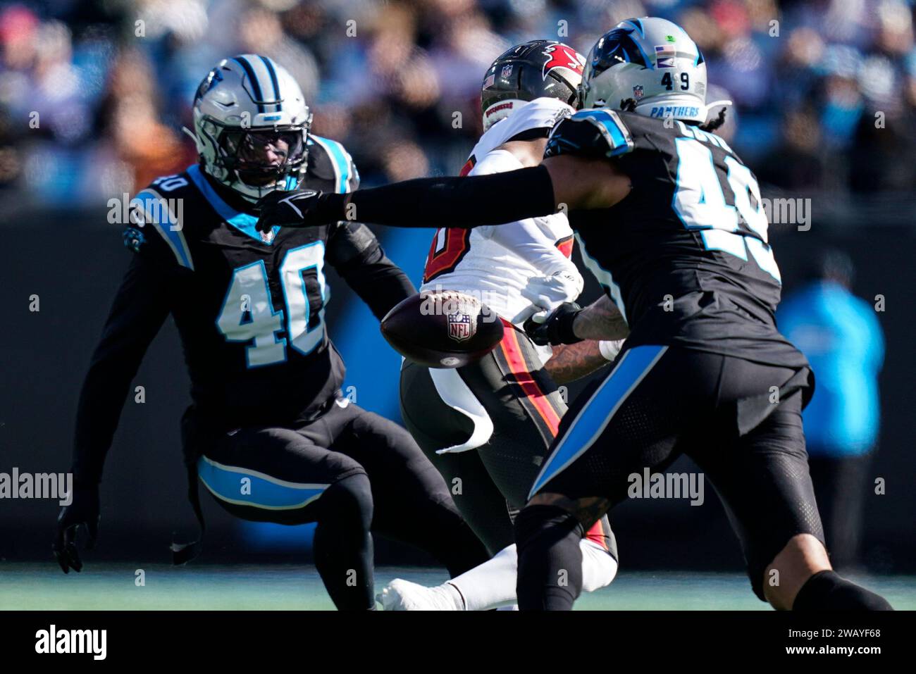 Carolina Panthers linebacker Frankie Luvu (49) forces a fumble on Tampa ...