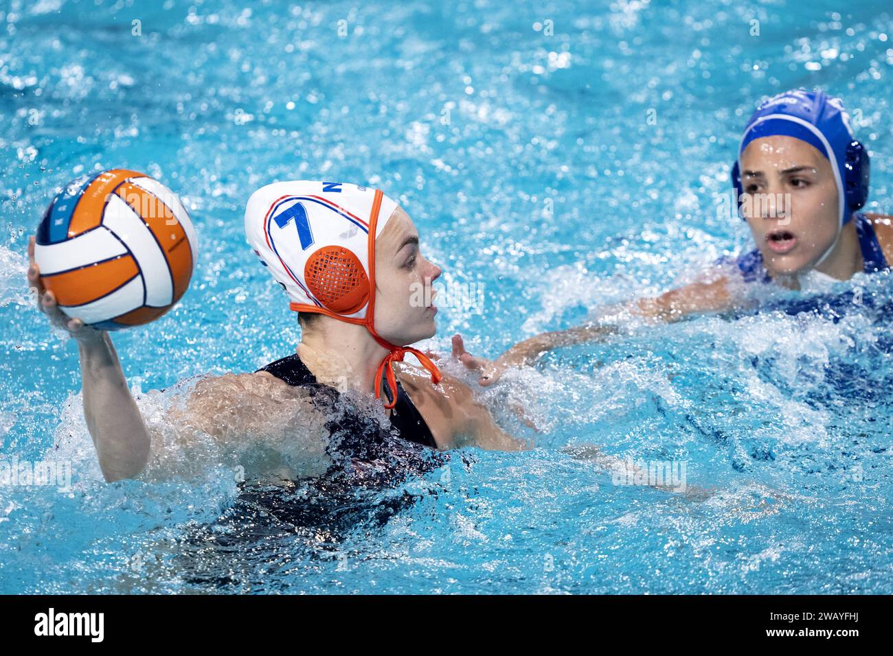 EINDHOVEN - Bente Rogge of the Dutch water polo team (f) in action ...