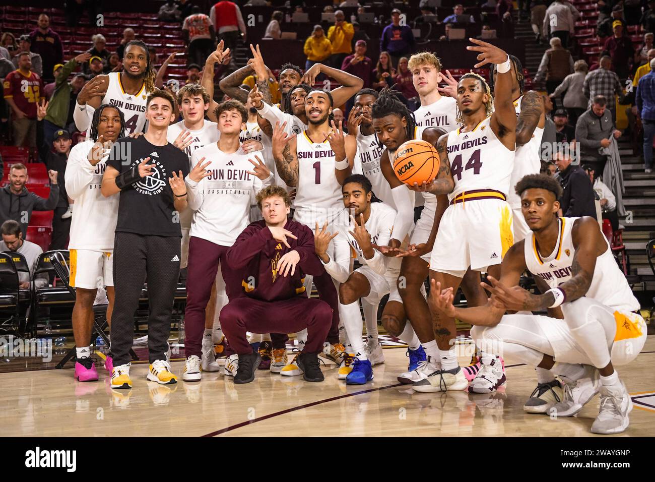 Arizona State Sun Devils pose for a photo after an NCAA basketball game ...
