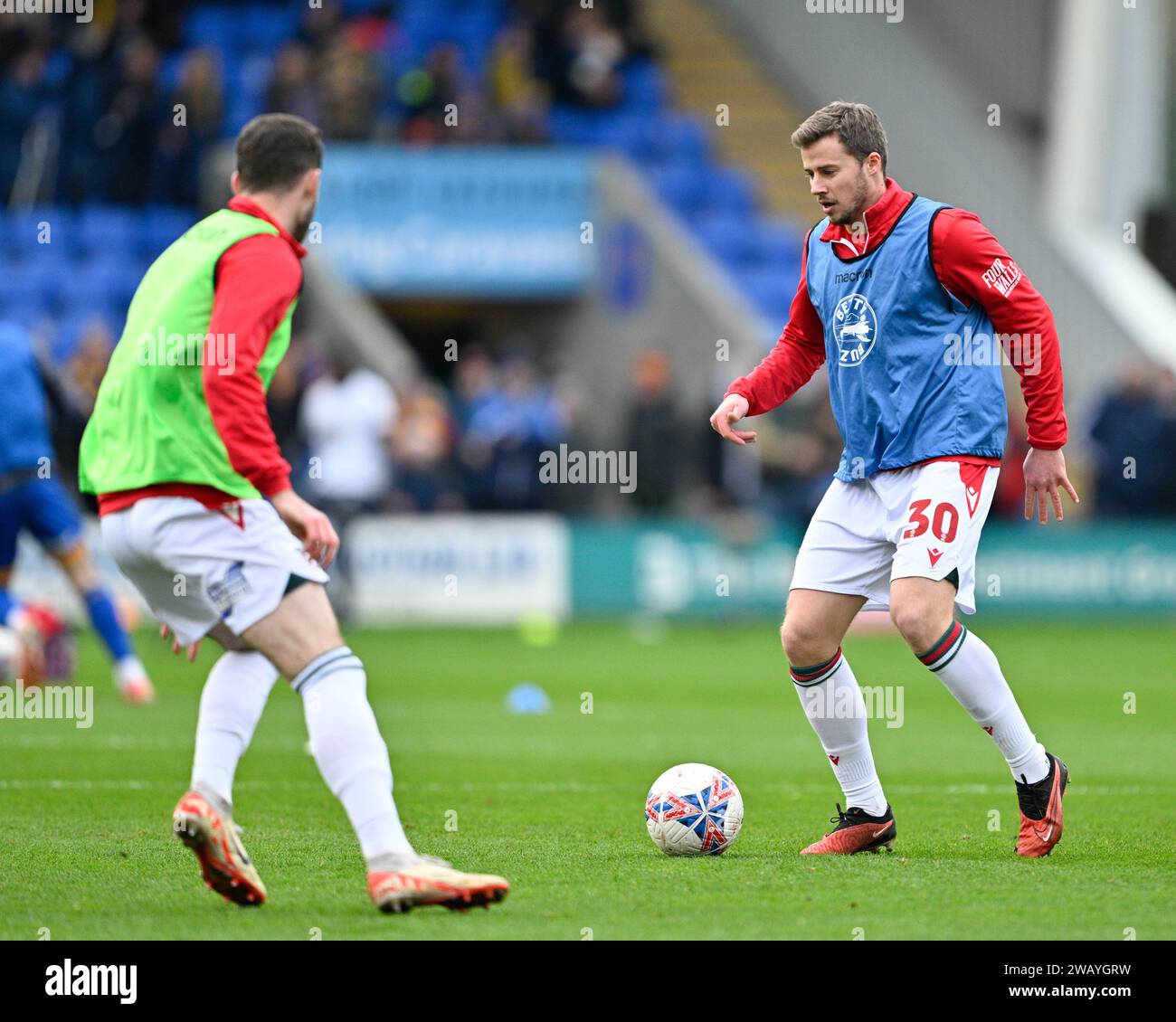 Shrewsbury, UK. 07th Jan, 2024. James Jones of Wrexham warms up ahead ...