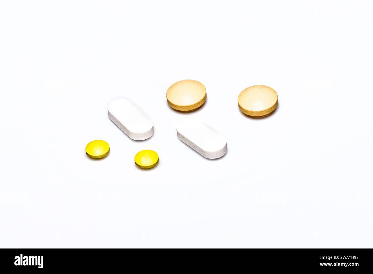 White yellow medication capsules hi-res stock photography and images ...