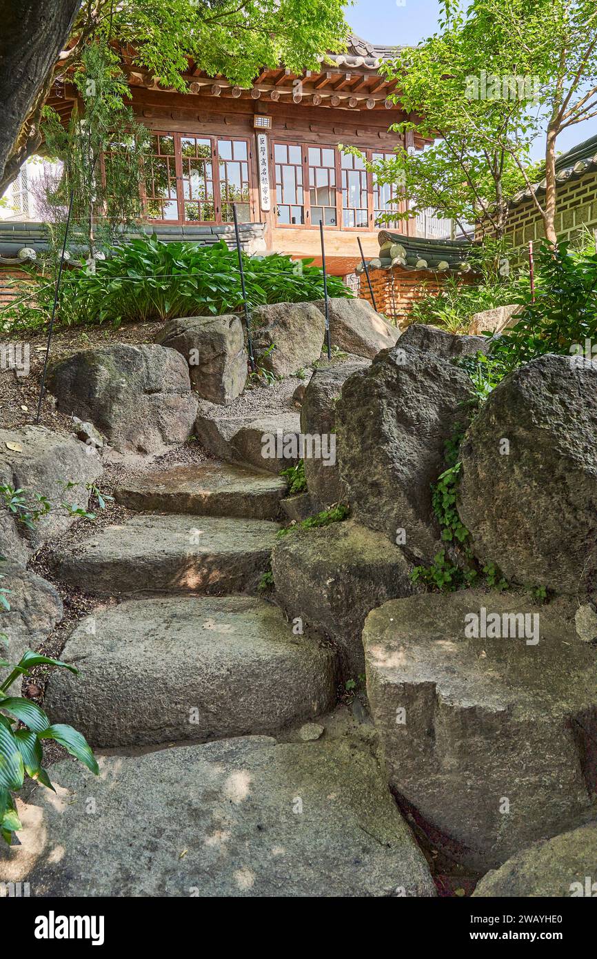 A stone stairs in the garden of Beak Inje House, a traditional Korean ...