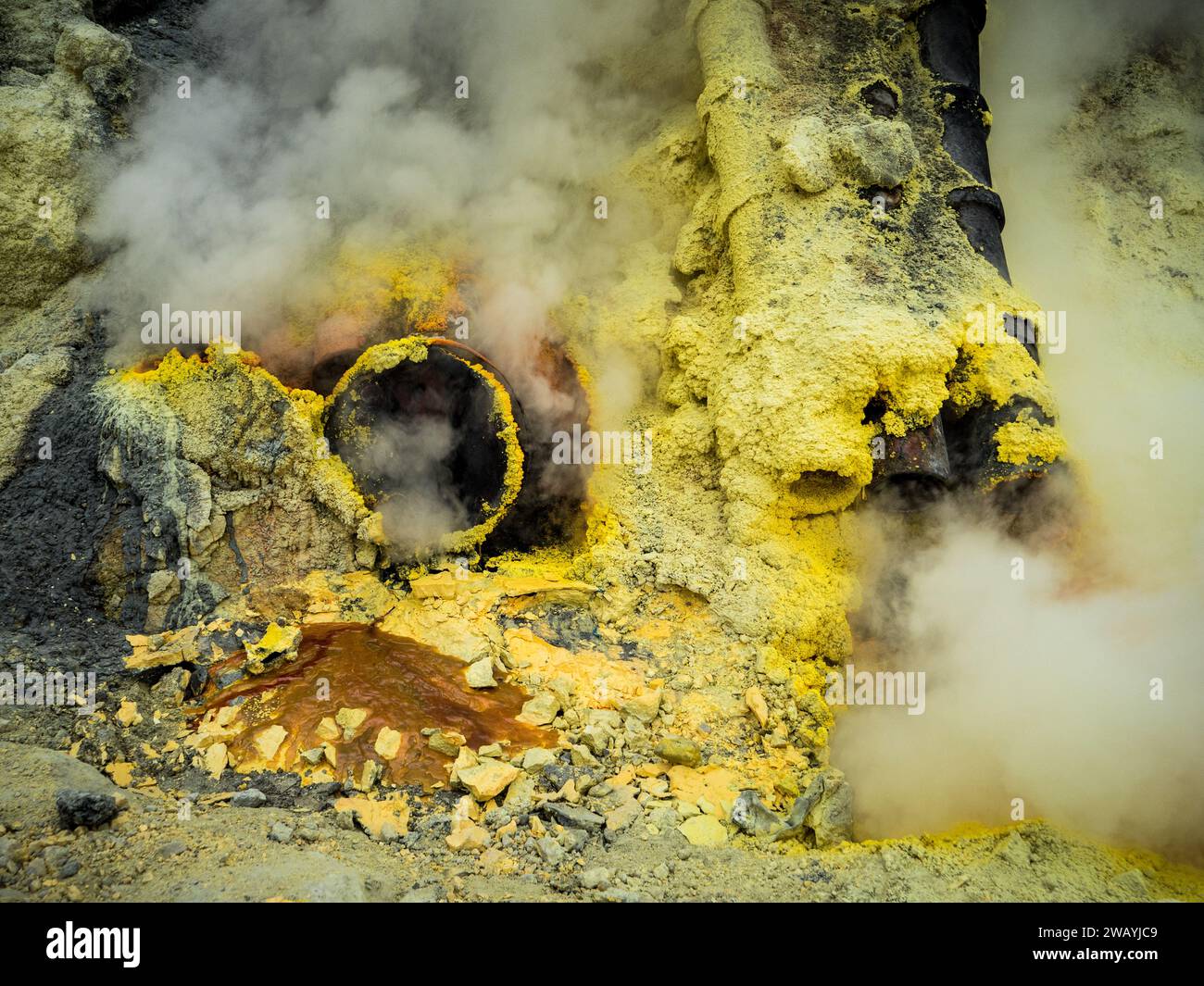 Smoking pipes used in sulfur mining at Kawah Ijen volcano Stock Photo ...
