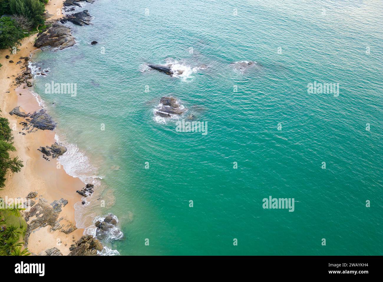 Top down aerial view of a beautiful sandy beach and warm, tropical ...