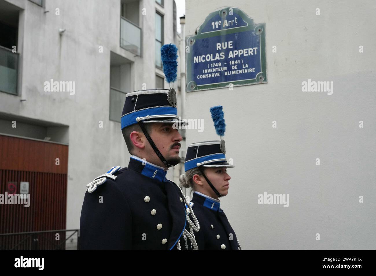 Paris, France. 07th Jan, 2024. Law enforcement members stand under a ...