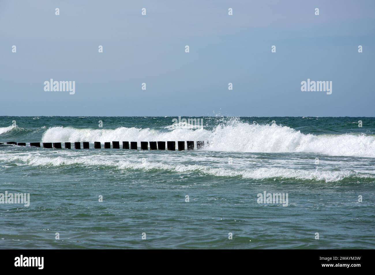 A groyne is a dam built in front of the sea, usually at right angles to ...