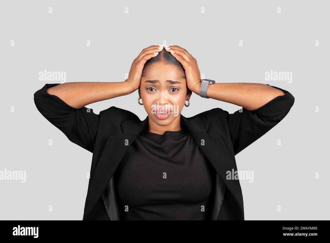 Stressed African American businesswoman in formal wear with hands on ...