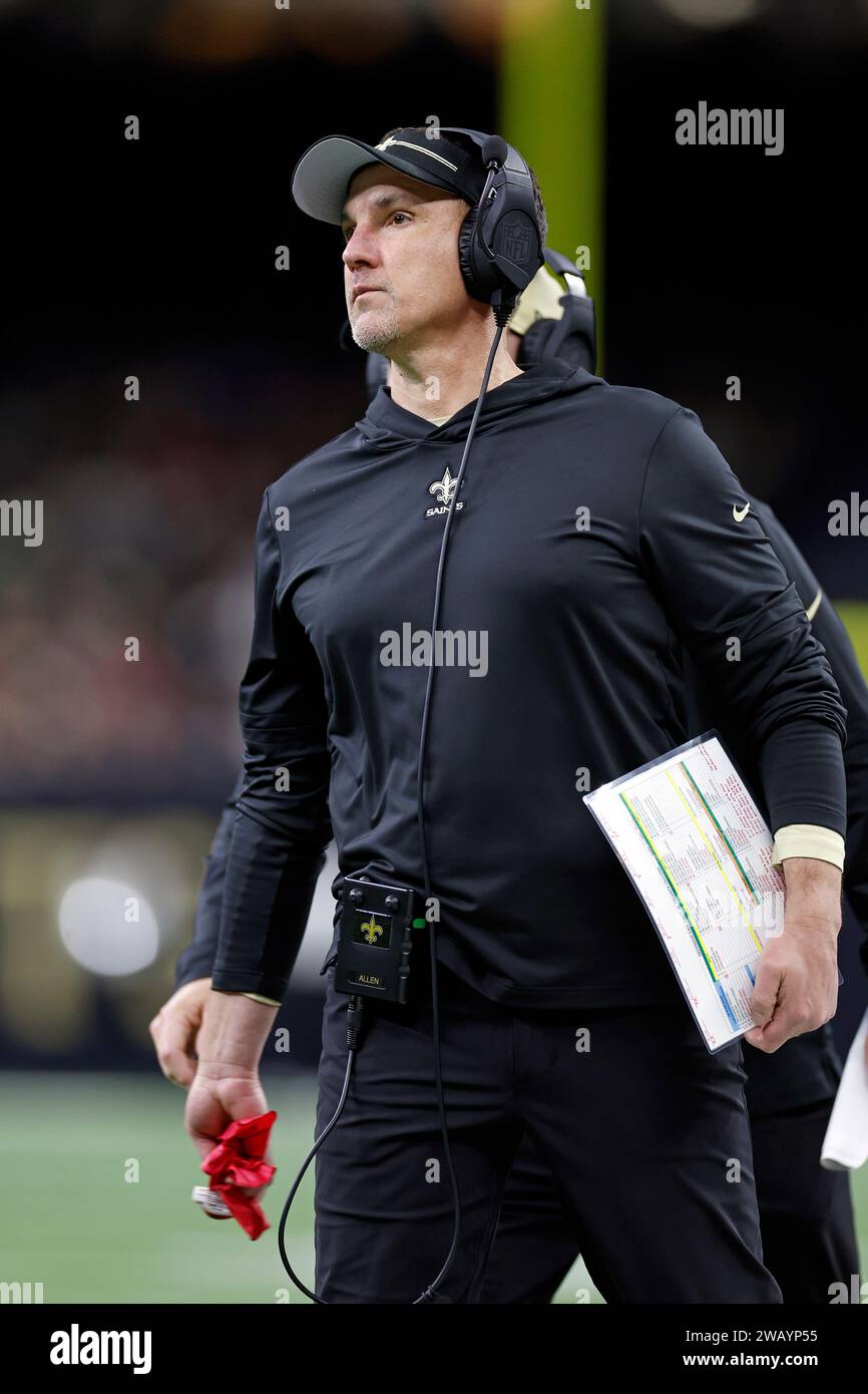 New Orleans Saints head coach Dennis Allen throws the red challenge flag during an NFL football ...
