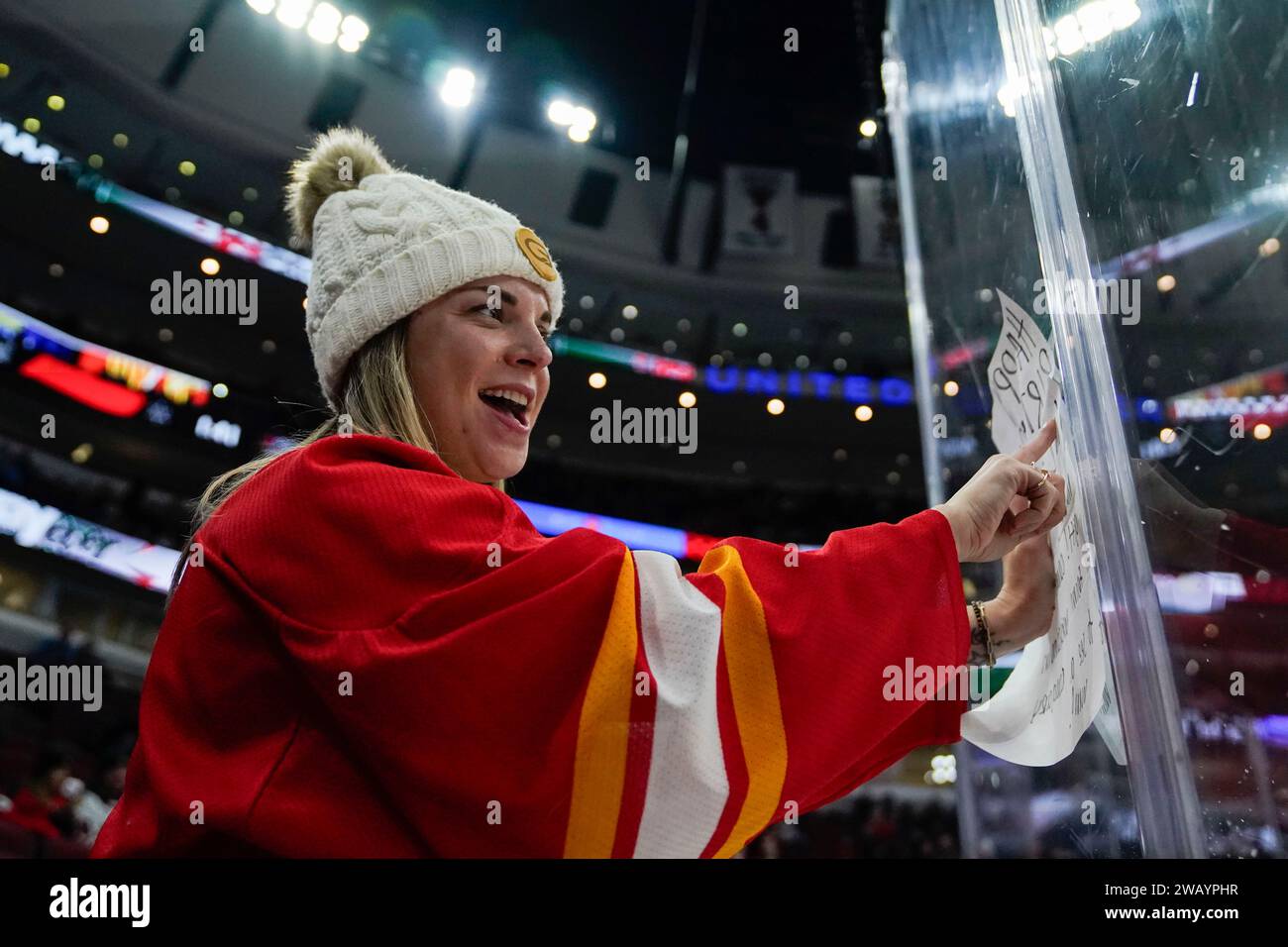Allyssa Gnacinski of Milwaukee holds up a sign wishing Calgary Flames ...