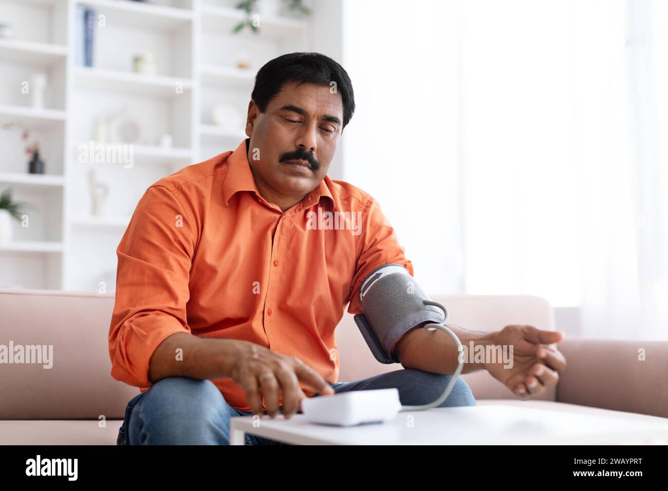 Mature indian man doing morning checkup after waking up Stock Photo - Alamy