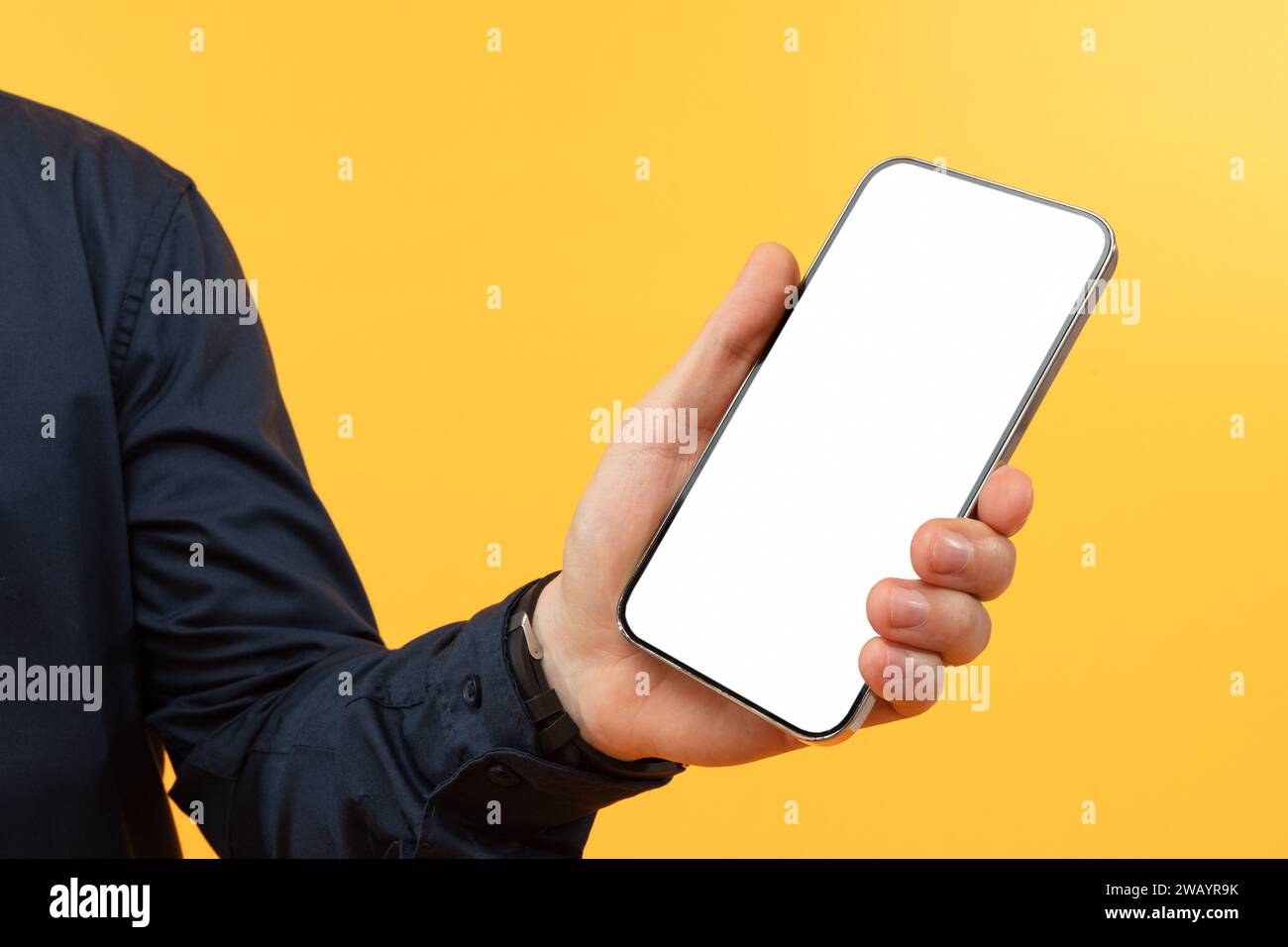 Cropped of man holding phone with white screen Stock Photo - Alamy