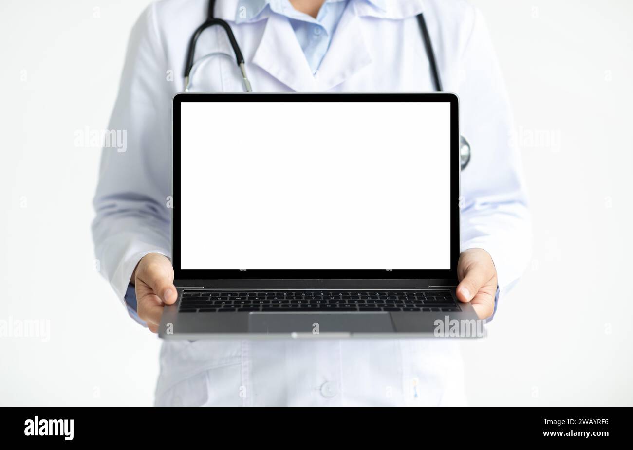 Laptop with white blank screen in woman doctor hands Stock Photo - Alamy