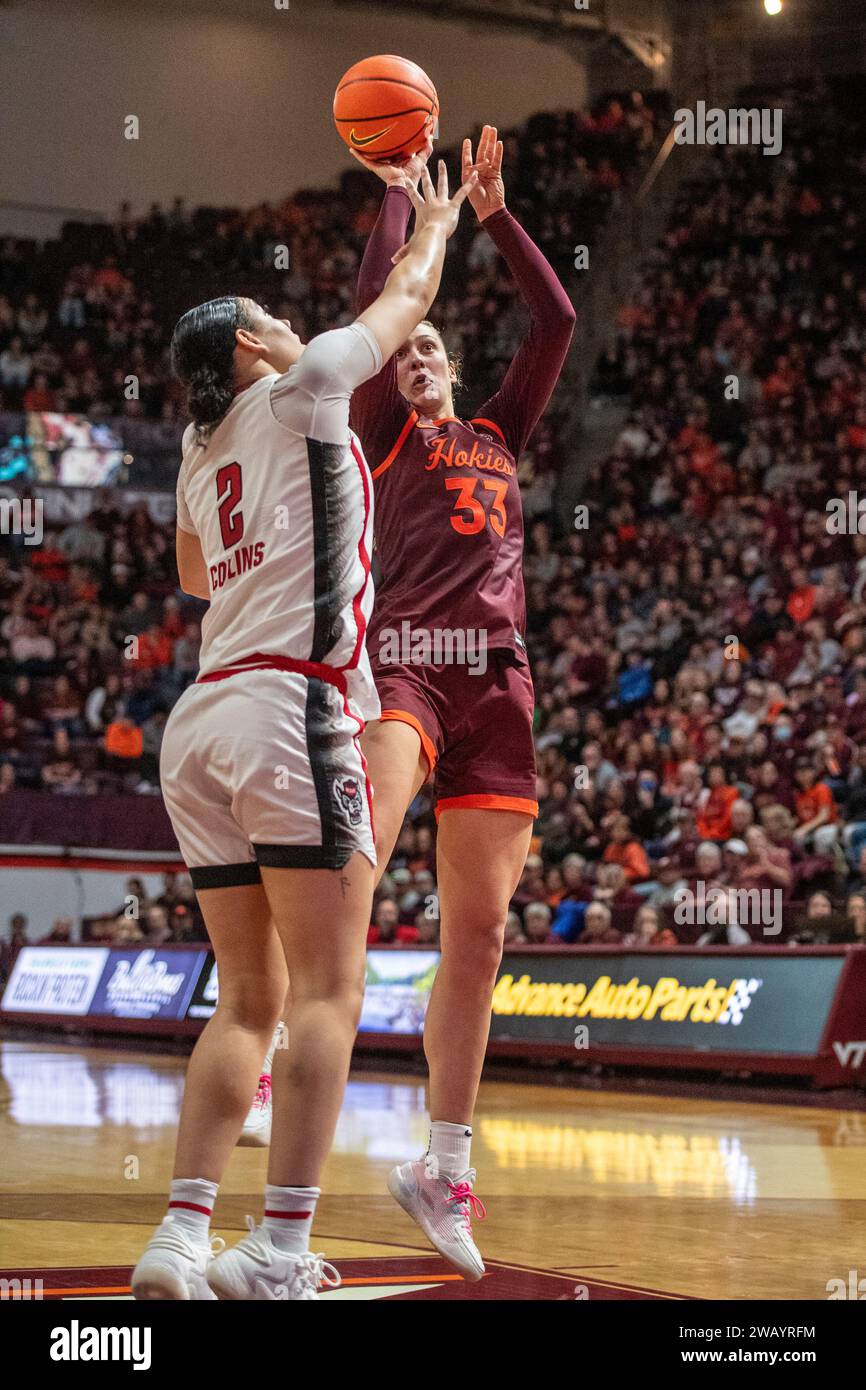 Virginia Tech's Elizabeth Kitley shoots the ball over NC State's Mimi ...