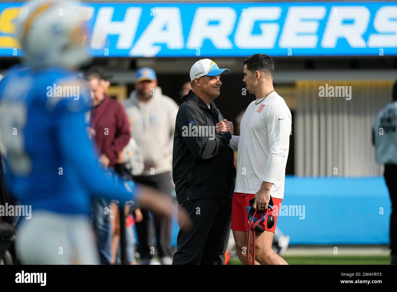 Los Angeles Chargers interim head coach Giff Smith, left, talks with ...