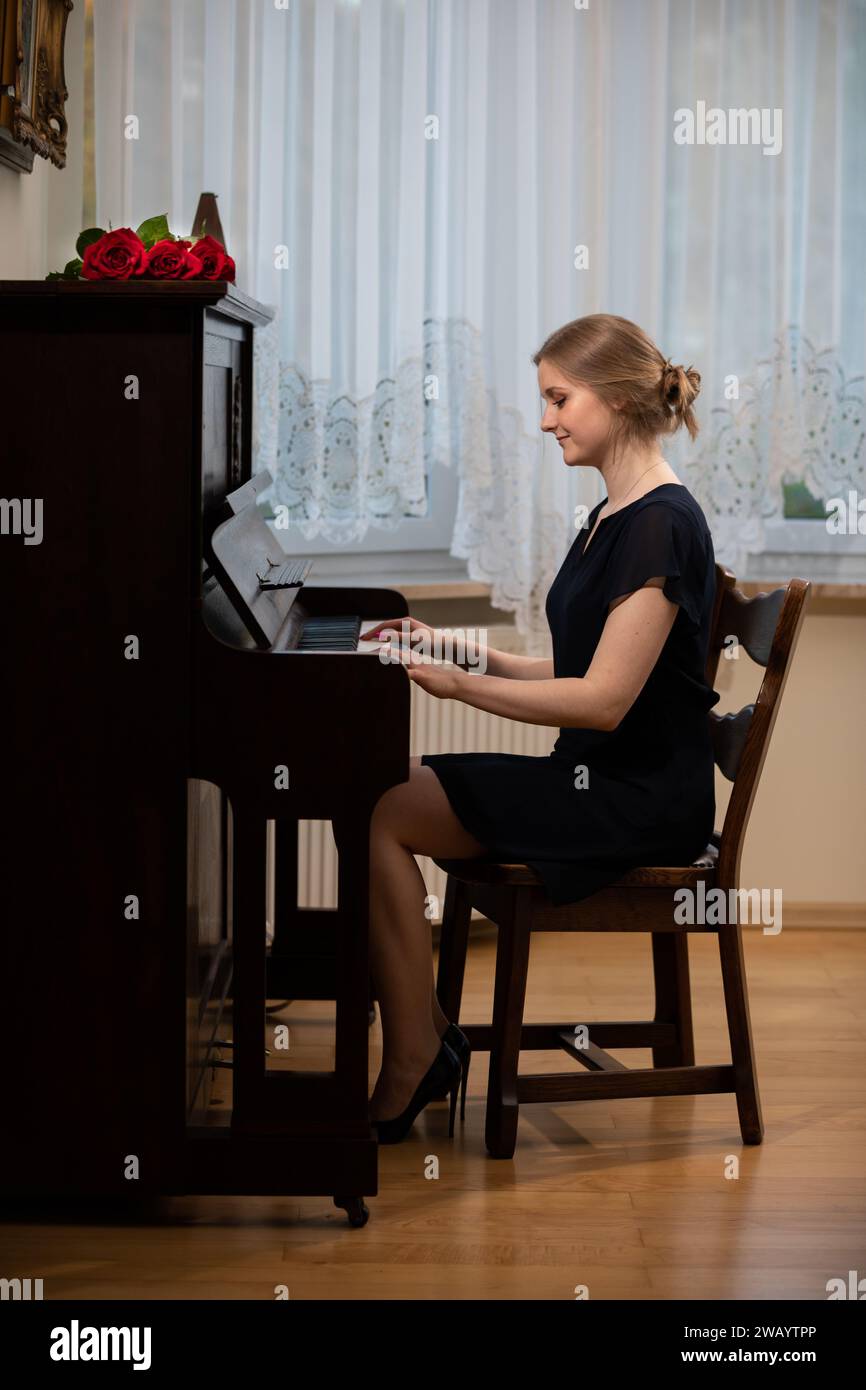 Learning to play chords on a keyboard instrument Stock Photo - Alamy