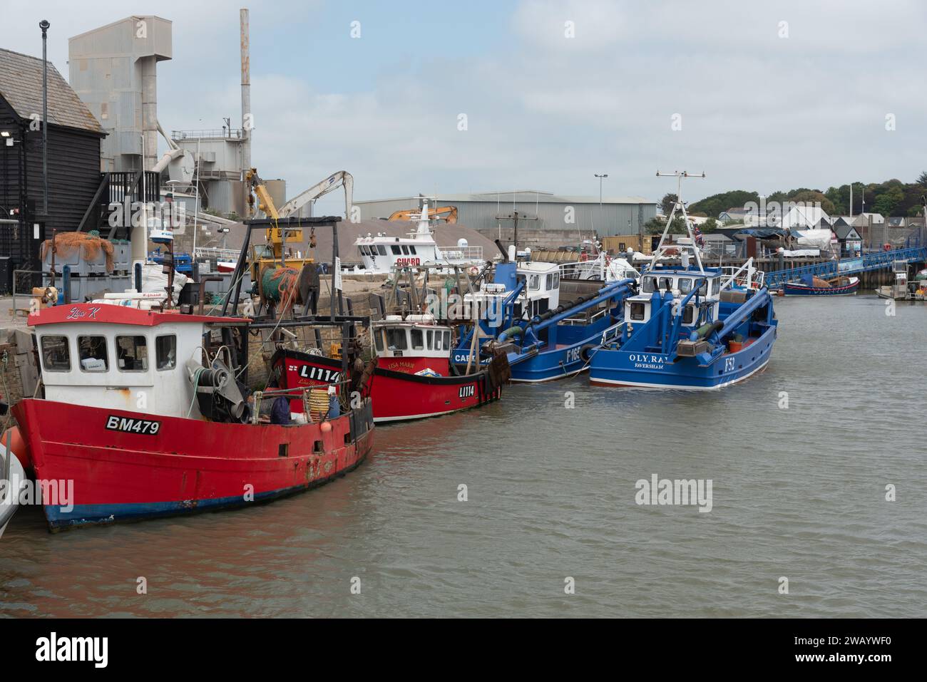 Fishing boats moored at Whitstable harbor in Kent England Stock Photo ...